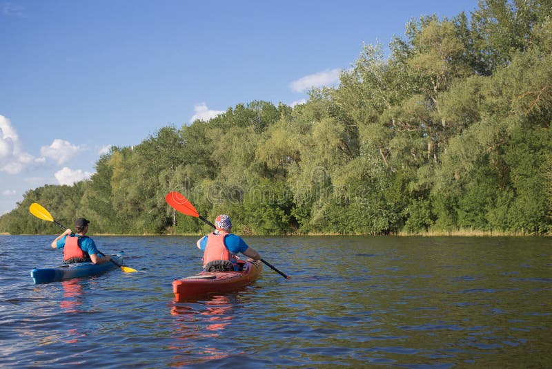 Two Guys Travel the River on a Kayaking. Stock Photo - Image of people ...