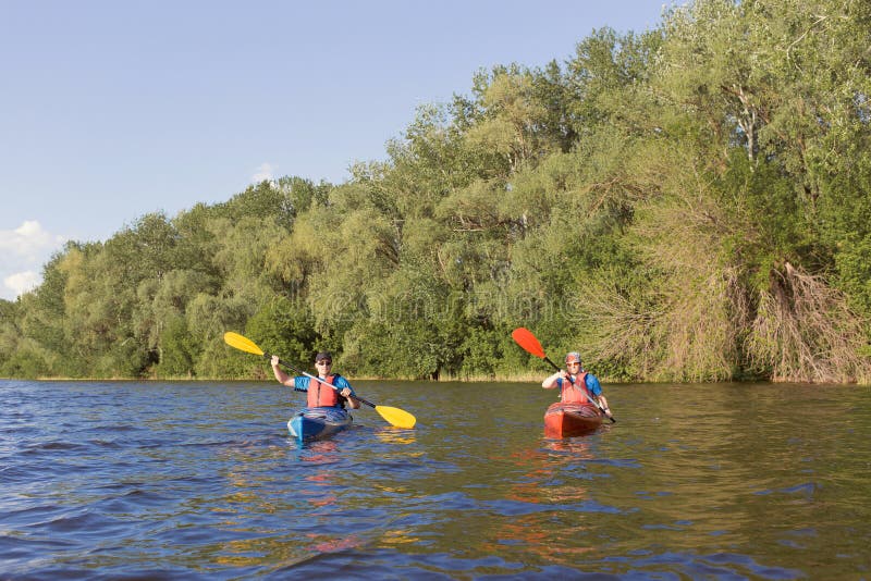 Two Guys Travel the River on a Kayaking . Stock Image - Image of people ...