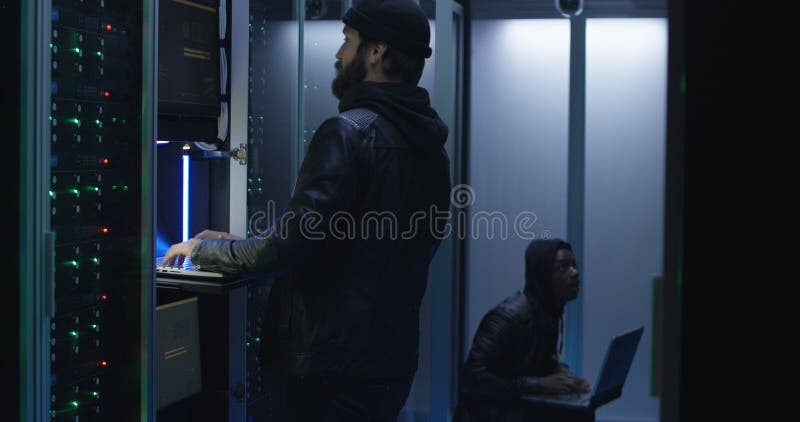 Two Hackers Beginning an Attack on Servers Stock Photo - Image of ...