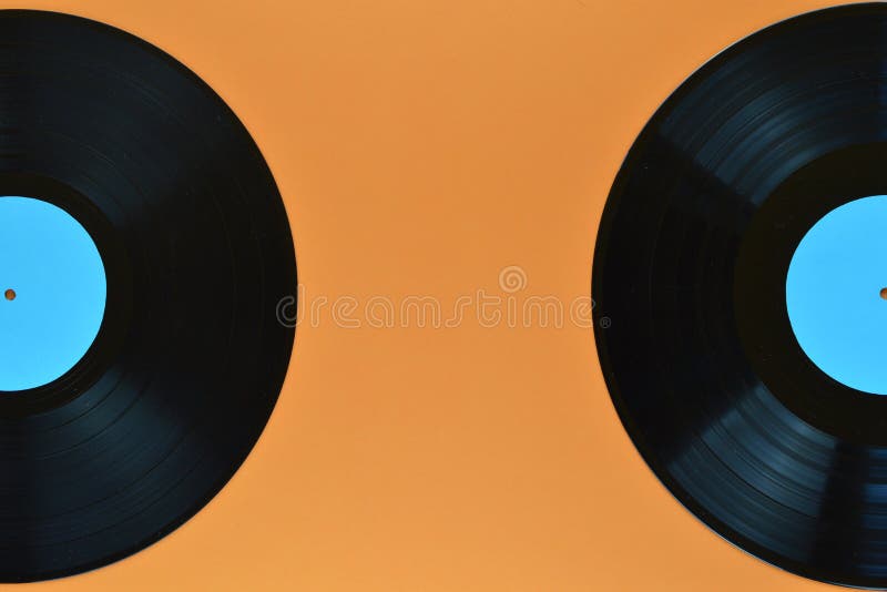 Two Half Black Vinyl Record on Orange Background Stock Image - Image of ...