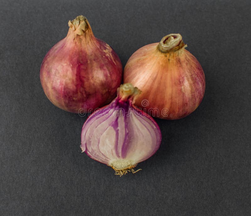 Two and a Half Medium Size Fresh and Ripe Red Onion Isolated on a White ...