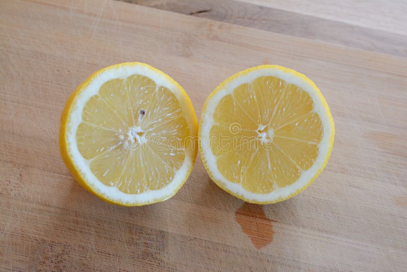Two Halves of Lemon on Wooden Table Top Stock Photo - Image of ...
