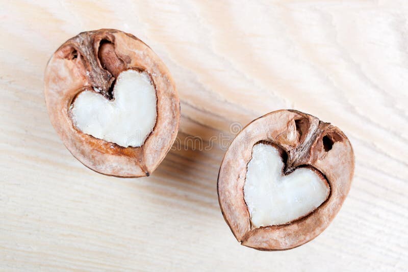 Two Halves of Walnut in Shape of Heart are Lying on Light Textured ...