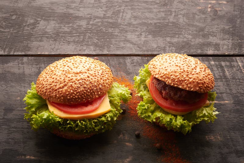 Two Hamburger on a Wooden Table Stock Photo - Image of burger, cafe ...