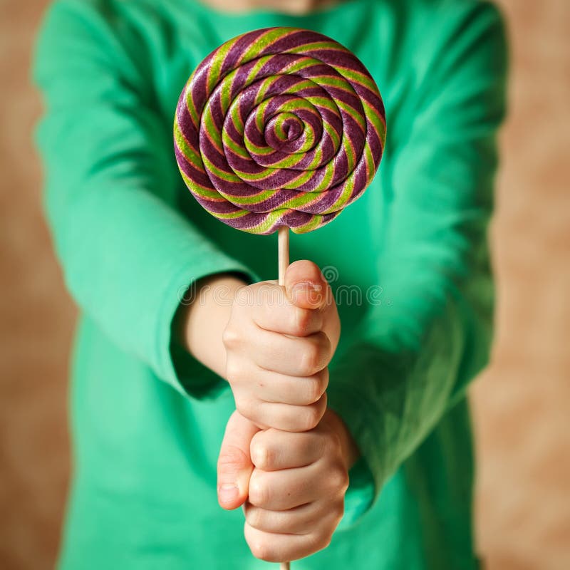 Two Hand Hold Lollipop in the Indoors, Square Stock Image - Image of ...