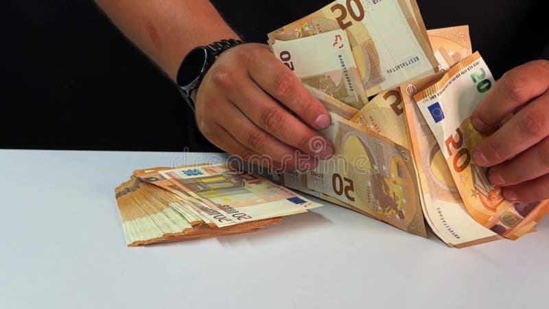 Two Hands Carefully Sort through Stacks of Euro Bills, Arranging the ...
