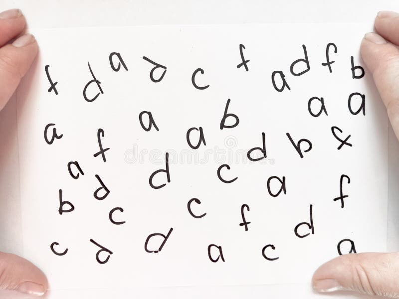 Two Hands Display a Sheet Covered with Black Handwritten Letters ...