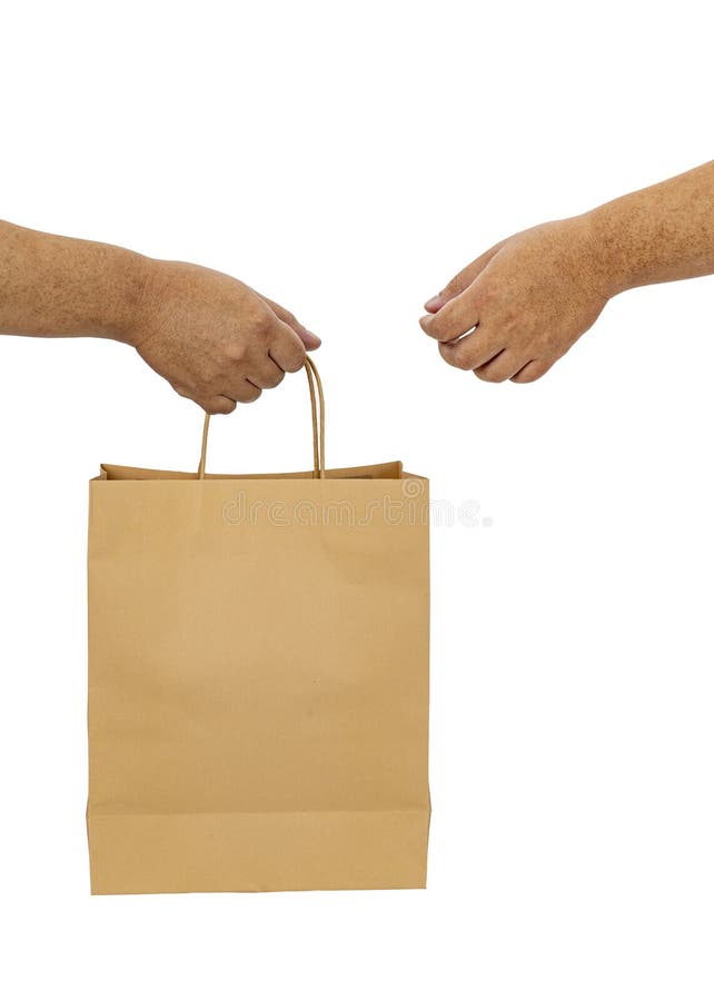Two Hands Exchanging Brown Paper Bag, Symbolizing Transaction or ...