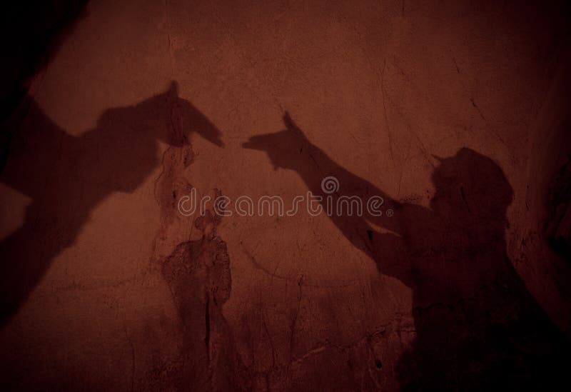 Two Hands Forming a Gun Shadow on the Wall in the Cave Stock Photo ...