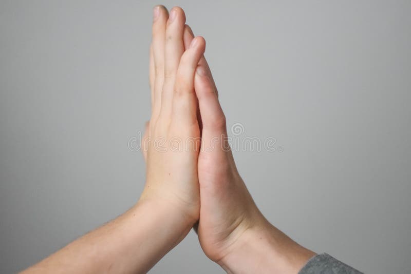 Two Hands Giving High Five stock image. Image of thumbs - 206513183