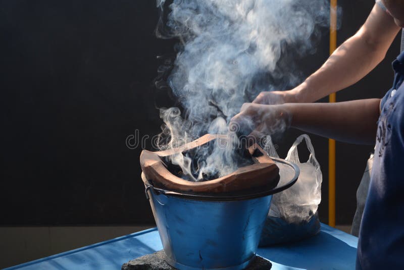 Two Hands Helped Kindled a Fire in Charcoal Stove Stock Image - Image ...