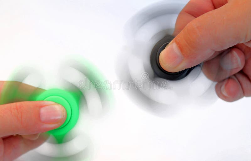 Two Hands Holding Fidget Spinners Stock Image - Image of fidget ...