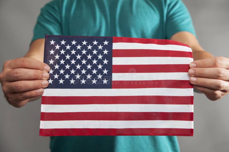 Two Hands Holding Flag stock photo. Image of fourth, july - 26563122