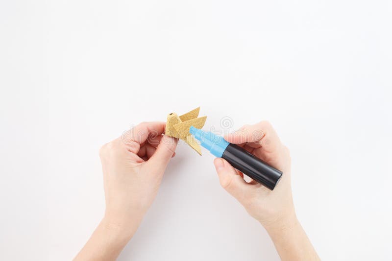 Two Hands Holding an Object and a Marker. a Crafting or DIY Activity ...