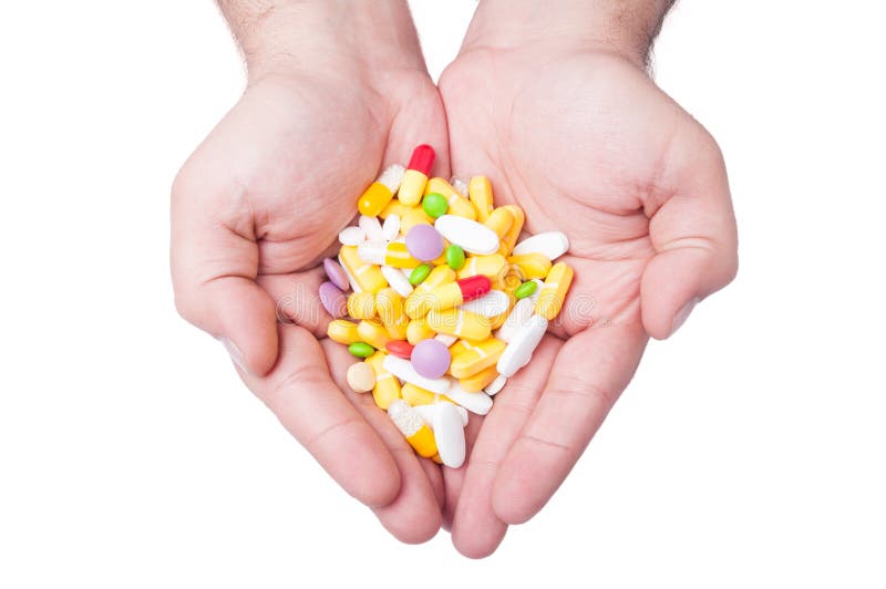 Two hands holding pills stock image. Image of multicolored - 48974081