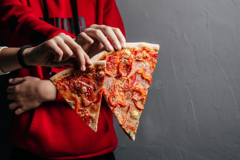 Two Hands Holding Two Slices of Pizza. Delicious Pizza in Hand Stock ...