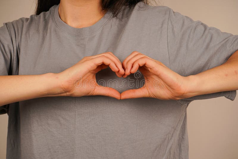 Two Hands Interlocked in the Shape of a Heart Deliver a Clear Message ...