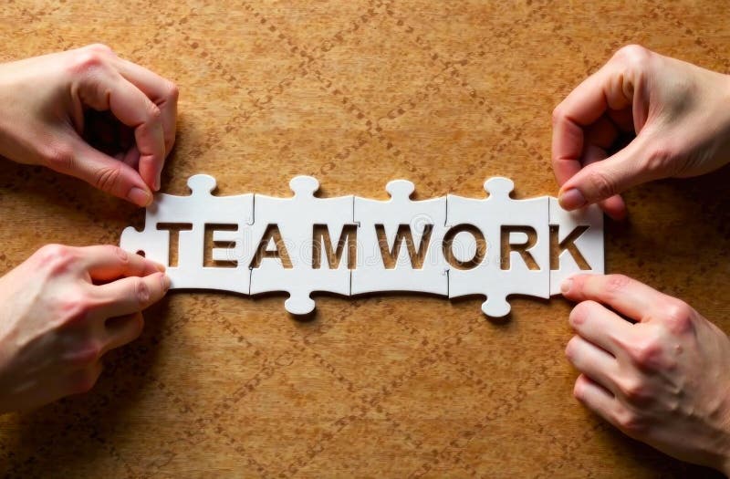 Two Hands Join Together To Connect Puzzle Pieces that Spell Teamwork ...