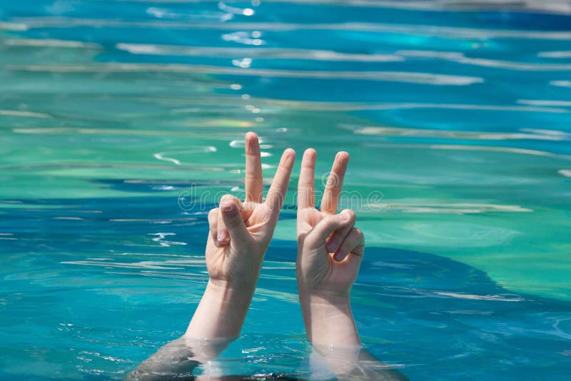 Two Hands Out of Water in Rock Gesture Stock Image - Image of rescue ...