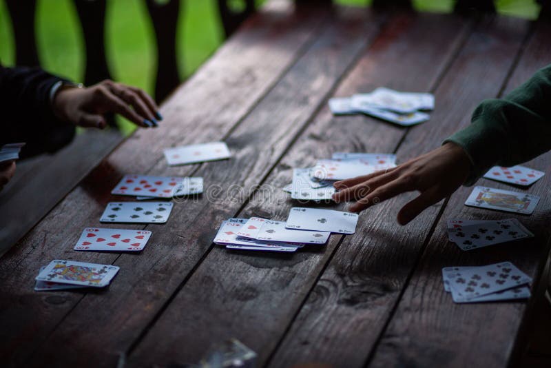 Two Hands Playing Cards on the Table Stock Image - Image of woman ...