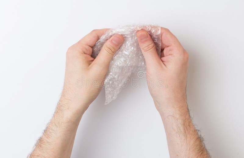 Hands Popping a Bubble Wrap on Classic Blue Background, Antistress ...