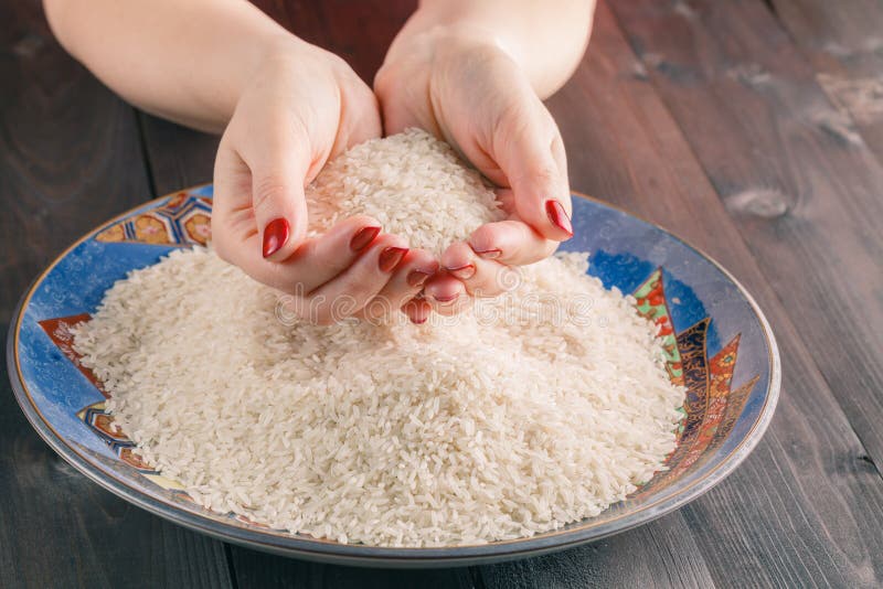 Two Hands Rice Grains Over Plate Stock Photos - Free & Royalty-Free ...