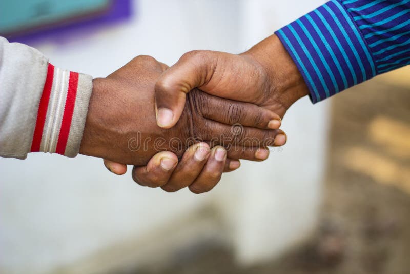 Two Hands Shaking Hands Together and the Background is a Blur Stock ...