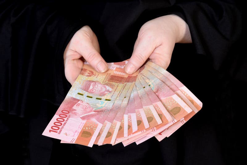 Two Hands Showing Several Red Banknotes on Black Background Stock Image ...