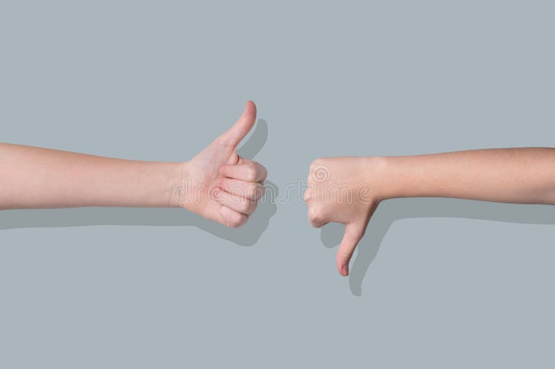 Two Hands Showing Thumbs Up and Thumbs Down Gestures on a Red and Green ... Two Hands Showing Thumbs Up and Thumbs Down Gestures on a Red and Green ...