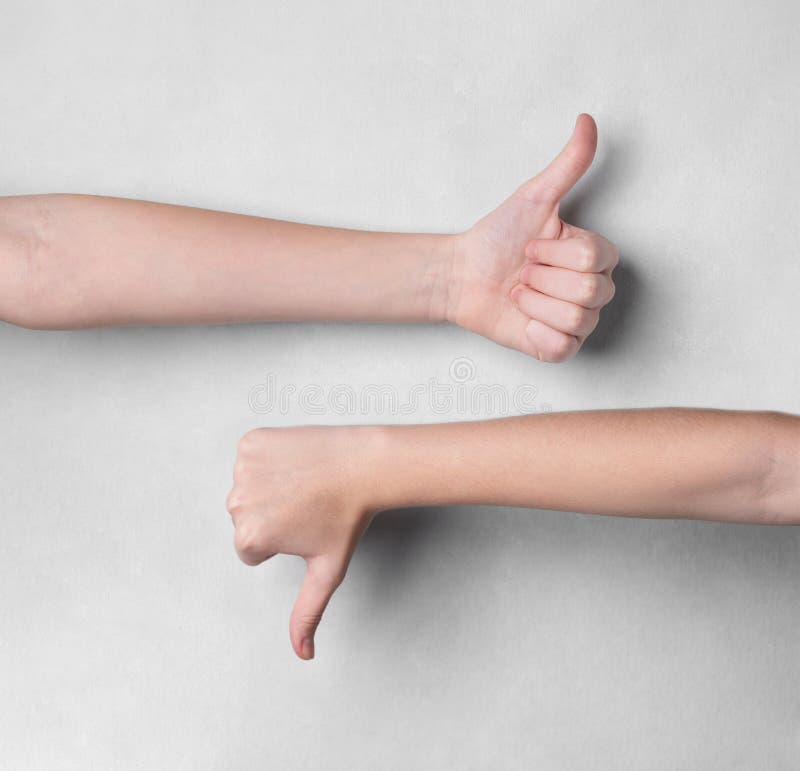 Two Hands Showing Thumbs Up and Thumbs Down Gestures on a Red and Green ... Two Hands Showing Thumbs Up and Thumbs Down Gestures on a Red and Green ...