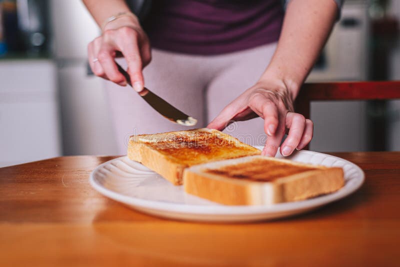 Two Hands Spreading Butter on Toast Stock Image - Image of piece, hold ...