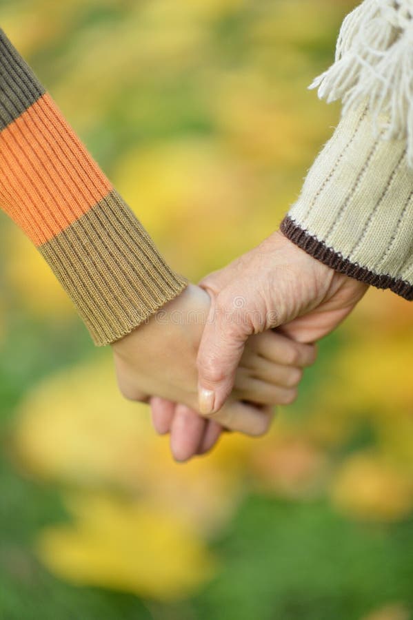 Two hands together in park stock image. Image of care - 102282373