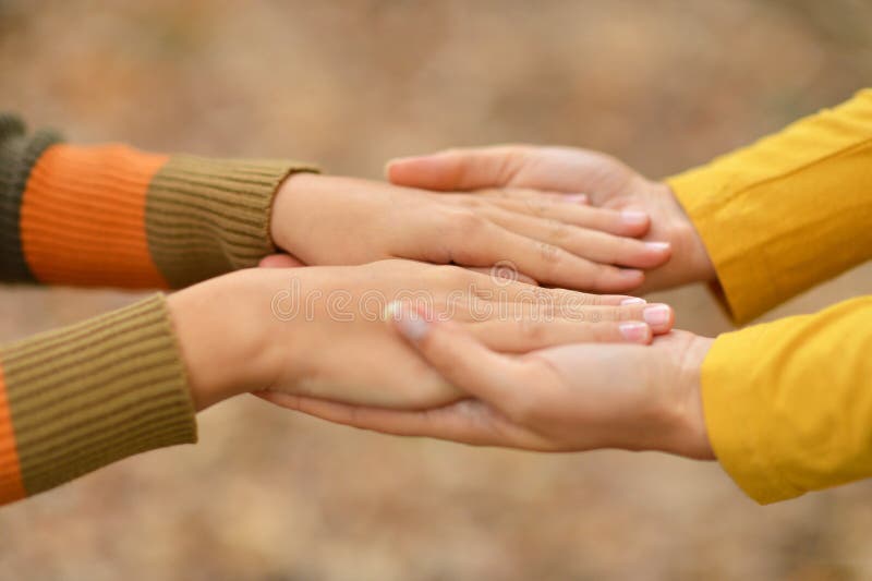 Two hands together in park stock photo. Image of real - 99627192