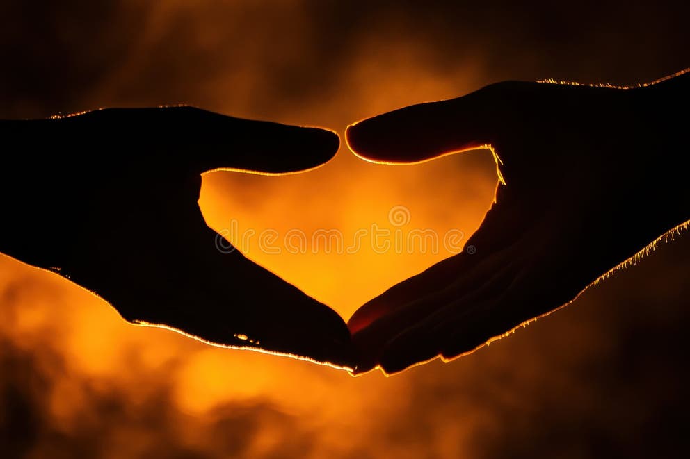 Two Hands almost Touching in a Backlit Silhouette with Strong Contrast ...