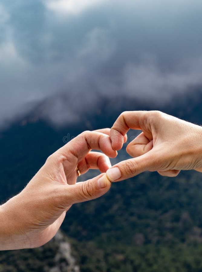 Two Hands Touching Each Other Making the Shape of the Heart with a ...