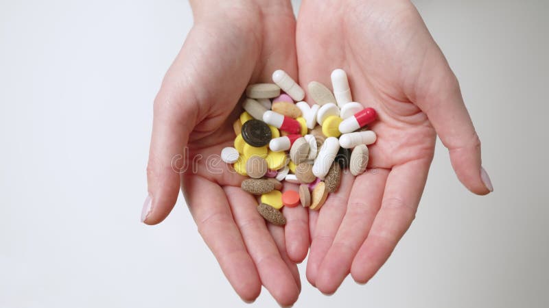 Two Open Hands Displaying Pills on White. Healthcare Choices in Focus ...
