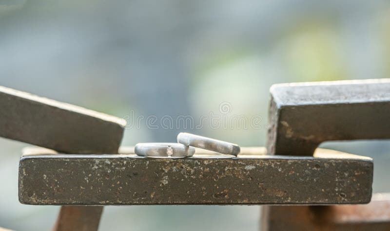 Two Hands with Wedding Rings Rest on a Strong Anchor Chain Stock Photo ...