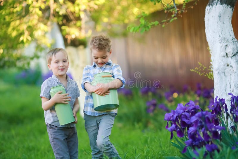 Two Handsome Brothers Having Fun while Sitting Outside in Garden Stock ...