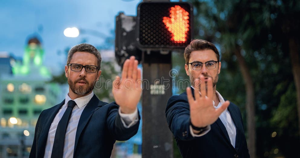Two Handsome Business Men in Suit Doing Stop Sing with Hand. Warning ...