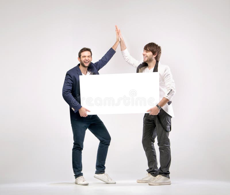 Two Handsome Friends Giving Each Other a High-five Stock Photo - Image ...
