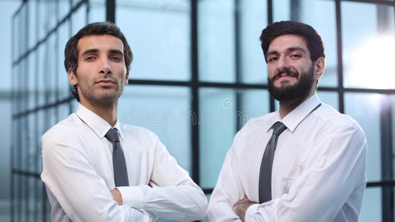 Two Serious Young Businessmen Standing with in Office Stock Video ...