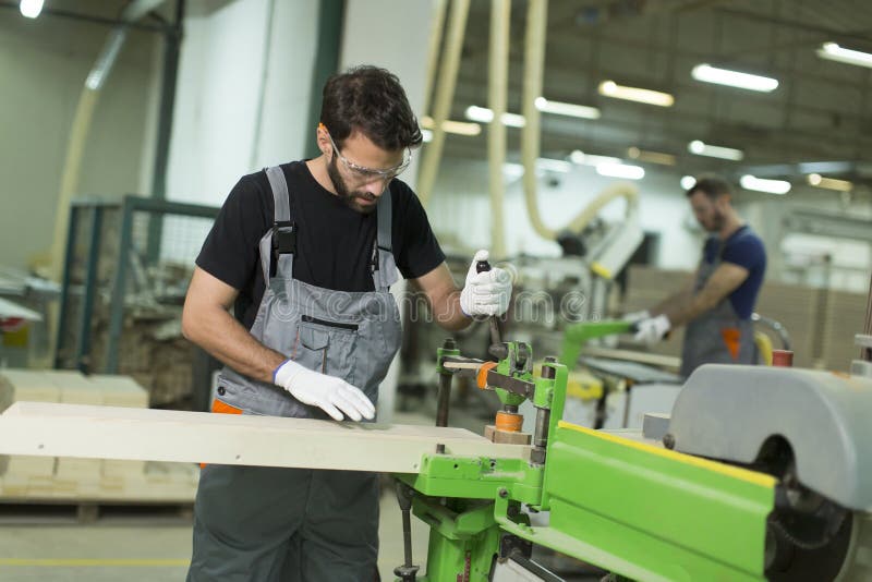 Two Handsome Young Men Working in Lumber Workshop Stock Image - Image ...