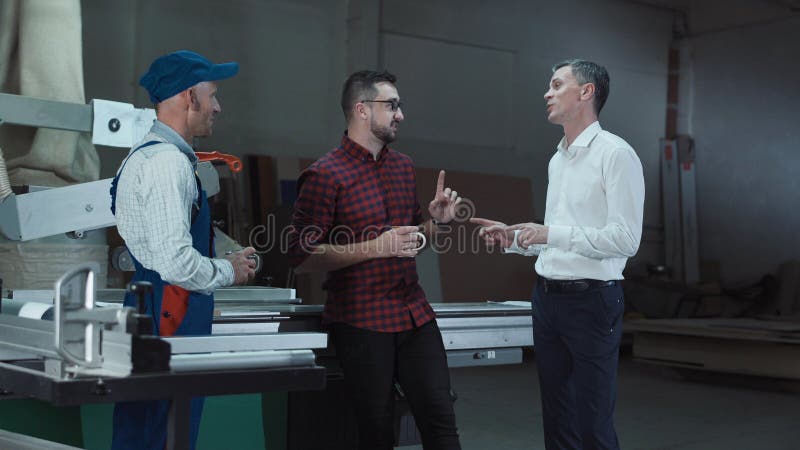 Workers and Foreman in Workshop Stock Photo - Image of occupation ...
