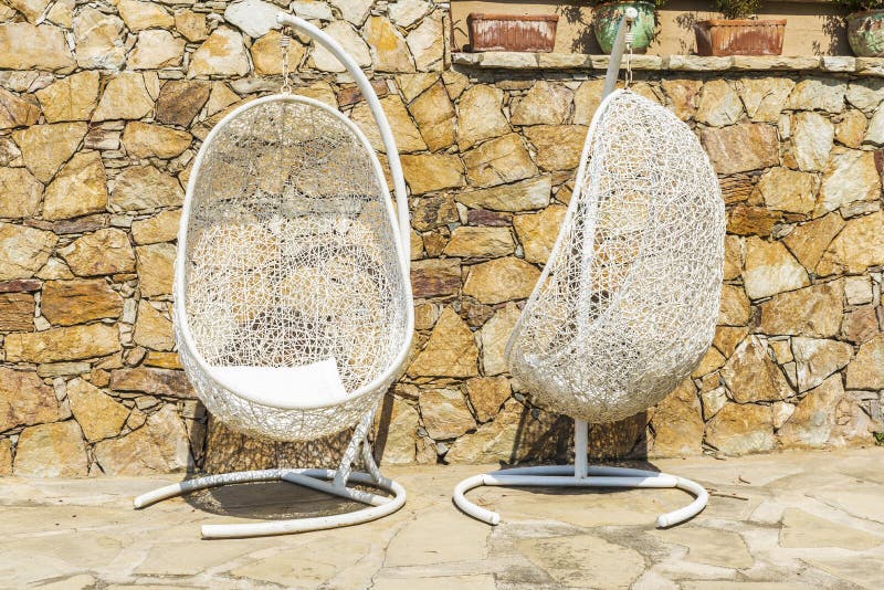 Two Hanging Chairs on the Terrace Stock Photo - Image of sunlight ...