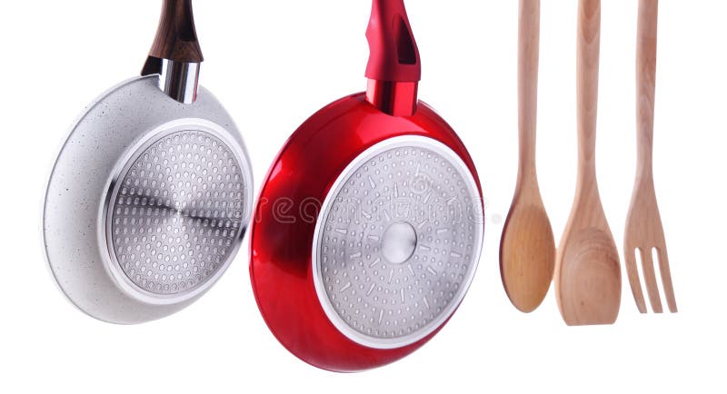 Two Hanging Frying Pans and Kitchen Utensils Stock Photo - Image of ...