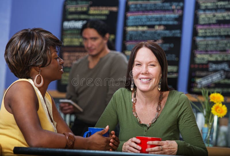 Two Happy Cafe Customers stock image. Image of indoors - 34216293