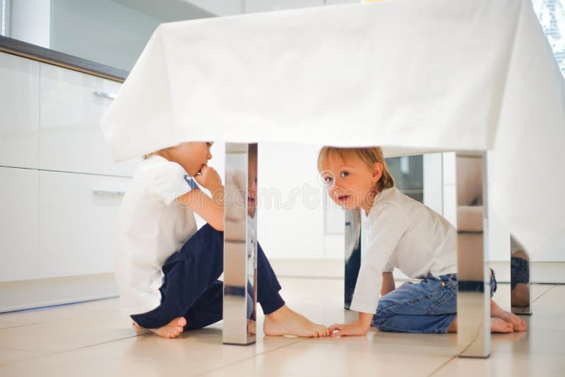 Two Happy Children in Kitchen Stock Photo - Image of hiding, family ...