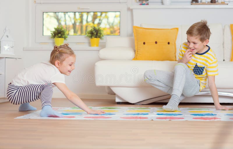 Two Happy Children Playing Exciting Game at Home Stock Photo - Image of ... Two Happy Children Playing Exciting Game at Home Stock Photo - Image of ...