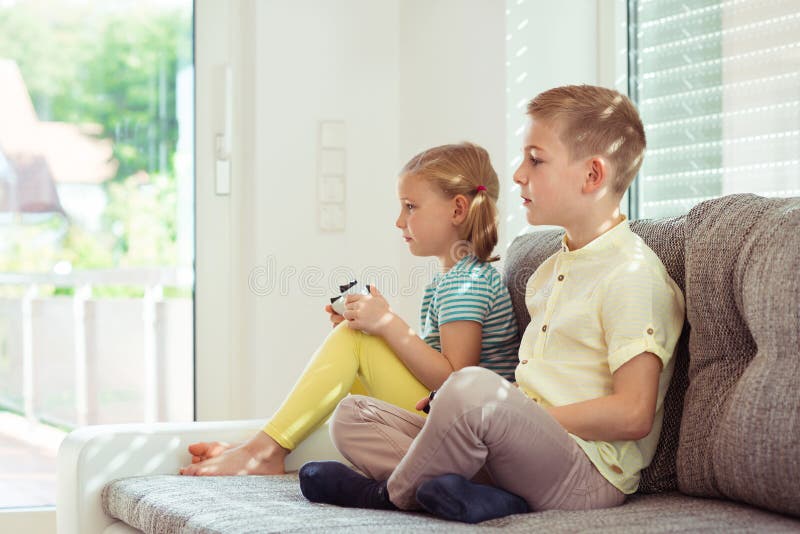 Two Happy Children Playing Video Games at Home Stock Photo - Image of ... Two Happy Children Playing Video Games at Home Stock Photo - Image of ...