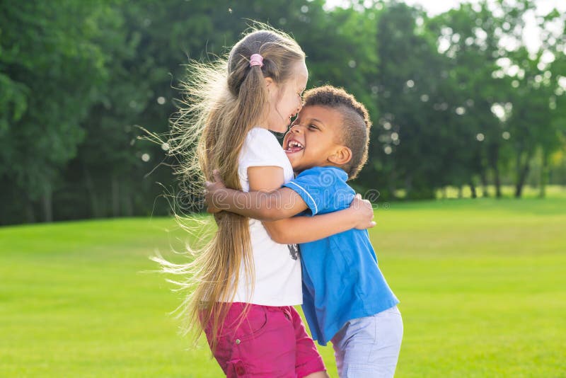 Two happy children. stock photo. Image of grass, long - 55760826